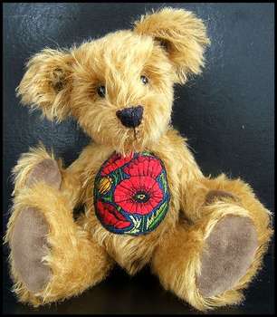 A hand embroidered Poppy Bear by Bears of Bath - Bear Pile